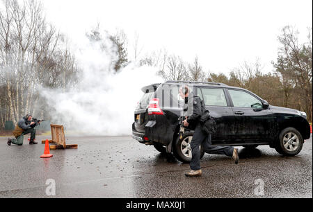 Members of the Close Protection Unit Royal Military Police clear a ...