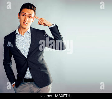 young pretty businessman posing emotional gesturing on white background, lifestyle people ...