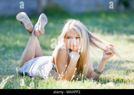 Adolescent teen laying lying down position posture Stock Photo - Alamy