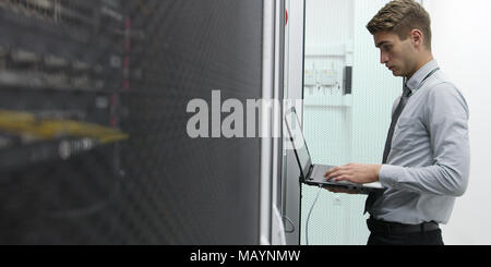 IT expert checking supercomputer server Stock Photo - Alamy