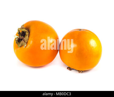 Two persimmon sharon fruits isolated on white with natural shadows ...