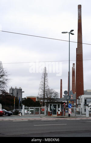 The camera-monitored entrance gate of a factory entrance to a factory ...