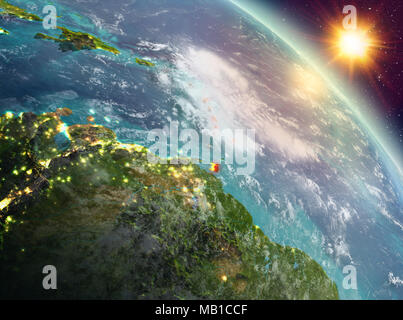 Sunrise above Caribbean highlighted in red on model of planet Earth in space with visible ...