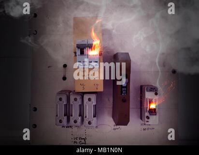 Overloaded electrical circuit causing electrical short and fire Stock ...