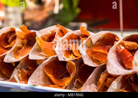 Small portions of salami wrapped in paper cones Stock Photo - Alamy