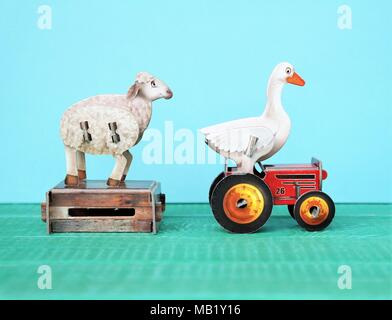 Two small funny toys baby snowman in knitted hats and scarves in deep ...