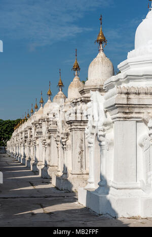 White kyauksa gu cave stupas at Kuthodaw Pagoda, Mandalay, Burma ...