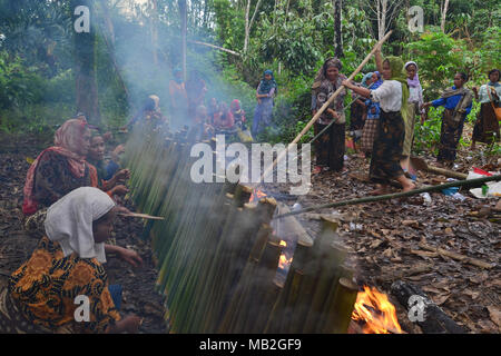 Meratus Dayak women make traditional food from sticky rice and cooked ...
