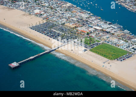 Aerial view of Newport Beach pier, homes, beach and harbor in Orange ...