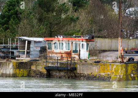 Run down abandoned building by the dock Stock Photo - Alamy