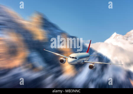 Modern airplane mith motion blur effect travel at sunny bright day ...
