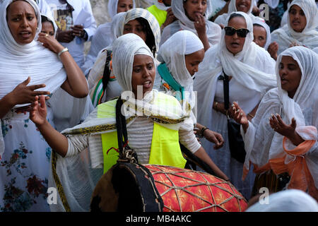 Ethiopian Orthodox worshipers playing the Kebero a double-headed ...