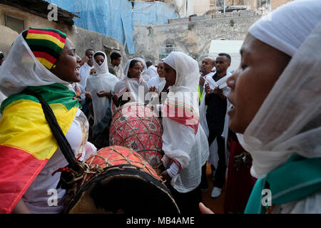Ethiopian Orthodox worshipers playing the Kebero a double-headed ...