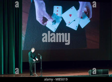 Magician and Illusionist Mike Super performs a close up card trick for ...