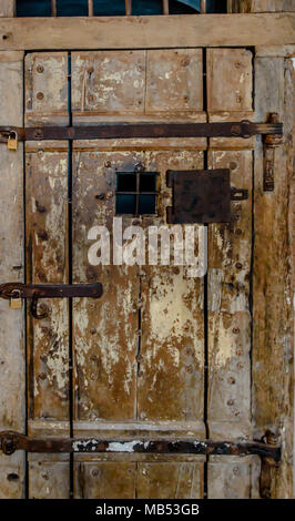 Prison door key with steel bars Stock Photo - Alamy
