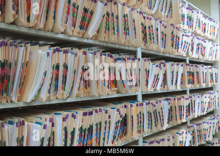 Still life of Patient records in file folders on steel shelving in A ...