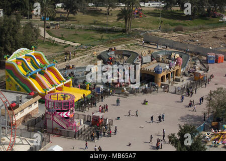 picture for Iraqi kids riding some games in Zawraa park in Baghdad city ...