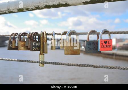 Love locks on the Tradeston Bridge, also known as the Squiggly Bridge ...