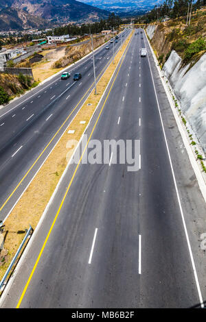 Segments of newly constructed asphalt highway with its white and yellow ...