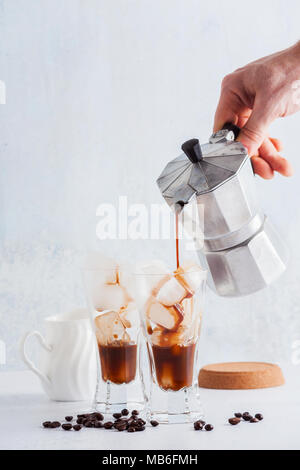 Glasses of cold brew coffee on table Stock Photo - Alamy