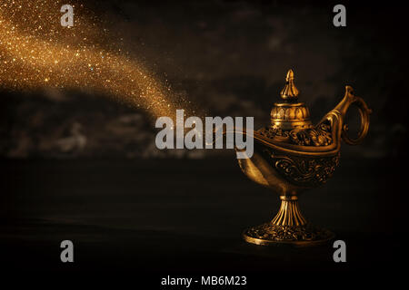 Image of magical mysterious aladdin lamp with glitter sparkle smoke ...