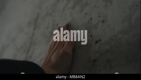 handheld of man hand touching concrete wall, wide photo Stock Photo - Alamy