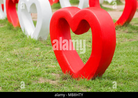 Big heart made from cement for decorative garden Stock Photo - Alamy