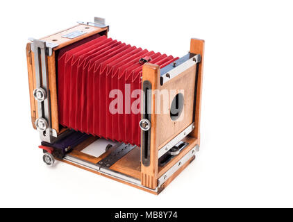 A folded Burke & James 4x5 format flatbed view camera with red bellows ...