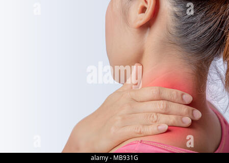 woman pain at trapezius muscle and holding right hand on muscle ...