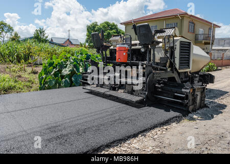 Asphalt paving equipment. Asphalt paver and heavy vibratory roller ...