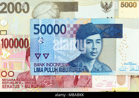 Indonesian rupiah currency in various banknotes denomination lying in ...
