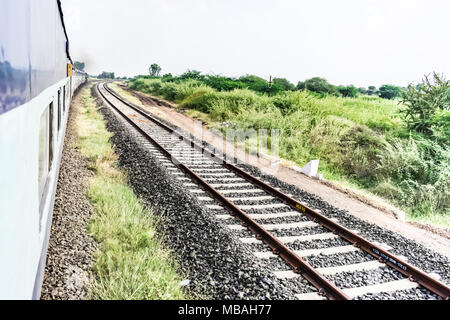 running train side view with railway track looking awesome Stock Photo ...