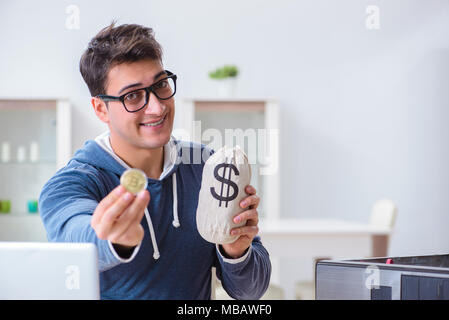 The young man mining bitcoins at home Stock Photo - Alamy