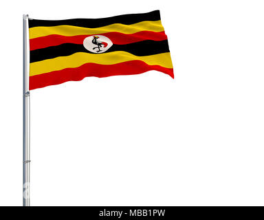 Isolate flag of Uganda on a flagpole fluttering in the wind on a blue ...