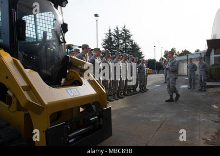 Col. John Winkler, 374th Mission Support Group commander, receives ...