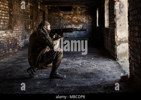 Arab soldier aiming with Kalashnikov AK-47 assault rifle Stock Photo ...