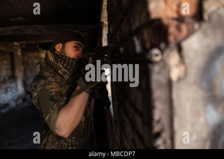 Arab soldier aiming with Kalashnikov AK-47 assault rifle Stock Photo ...