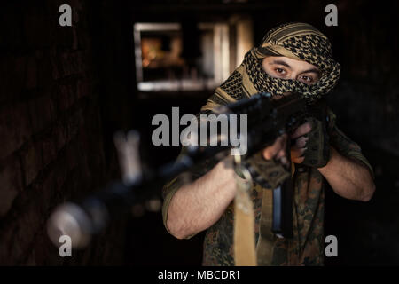 Arab soldier aiming with Kalashnikov AK-47 assault rifle Stock Photo ...