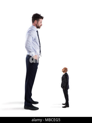 Giant boss and sad small man on grey background Stock Photo - Alamy