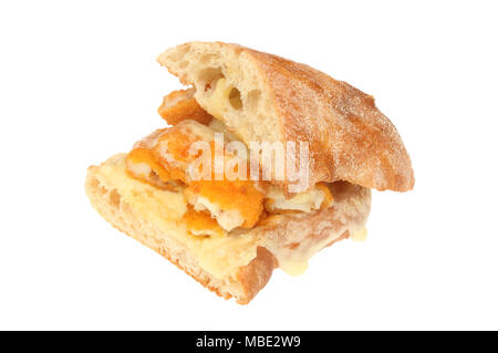Fish fingers with melted cheese in ciabatta bread on a plate isolated ...