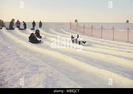 Tourists play at Harbin Ice and Snow World in Harbin City, northeast ...