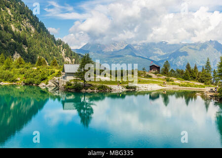 Amazing view on Aviolo Lake with forest and sky reflected on the water ...