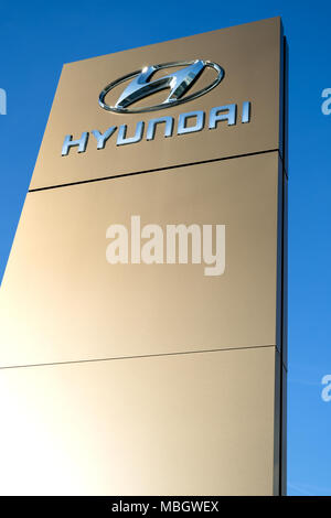 Hyundai dealership sign against blue sky. Hyundai Motor Company is a ...