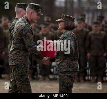 Brig. Gen. Jason Bohm, commanding general of Training Command, shakes ...