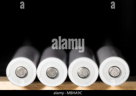 white batteries on the board, background image with space for text ...