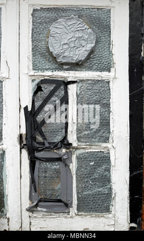 Insulation tape taped to an old wooden window frame to seal and ...