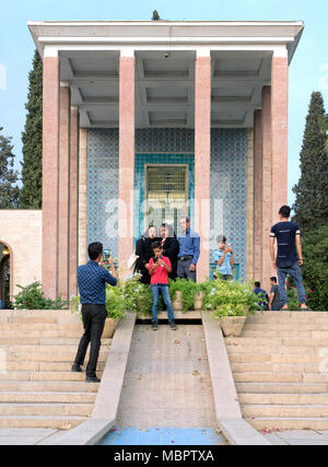 A family of tourists is taking a souvenir photo of the city in the ...