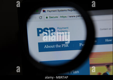 Payment Systems Regulator (PSR) seen through a magnifiying glass on a ...