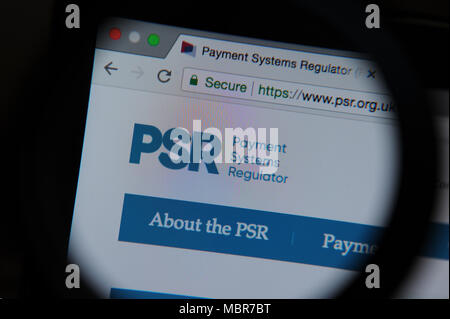 Payment Systems Regulator (PSR) seen through a magnifiying glass on a ...