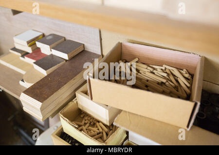 Stack of wood dowel pins construction nails on wooden background Stock ...